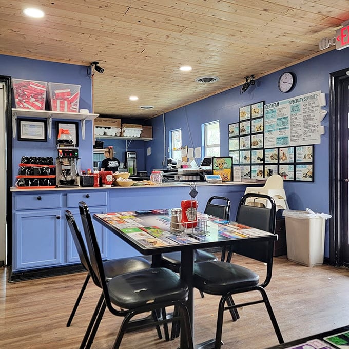 The counter view reveals the command center of comfort food operations&mdash;where ice cream dreams and diner classics come to life under warm wooden ceilings.