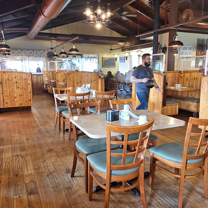 Wooden booths create cozy territories for serious eating. The kind of place where calories don't count and coffee refills appear like magic.
