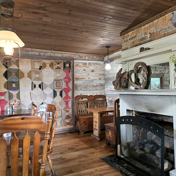 A fireplace, handmade quilt, and wooden everything&mdash;this dining nook feels like eating inside a warm, delicious hug from colonial America.