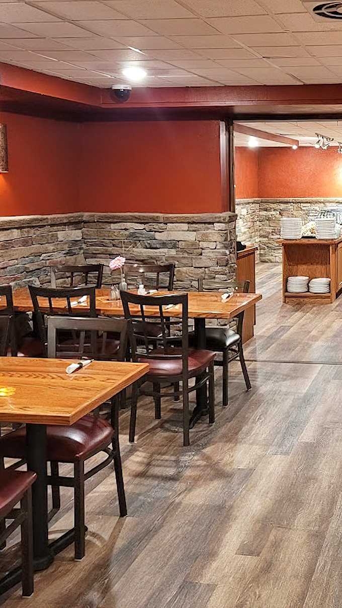 The dining room's stone accents and warm colors create an atmosphere where every meal feels like celebration.
