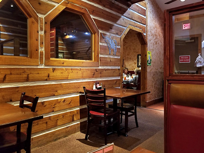 Wooden beams and cozy nooks create dining spaces that feel like your favorite cabin getaway, if that cabin happened to serve incredible barbecue.