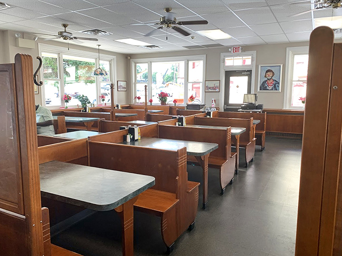 Morning light streams through windows into empty booths, each awaiting its daily parade of regulars, first dates, and road-trippers seeking omelet enlightenment.