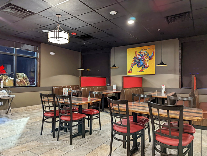 Another dining area showcases modern pendant lighting and colorful bull artwork&mdash;casual elegance that says "stay awhile" without trying too hard.