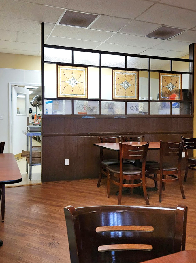 Stained glass dividers add unexpected elegance to this homey space, proving beauty can be found in the most unexpected places.