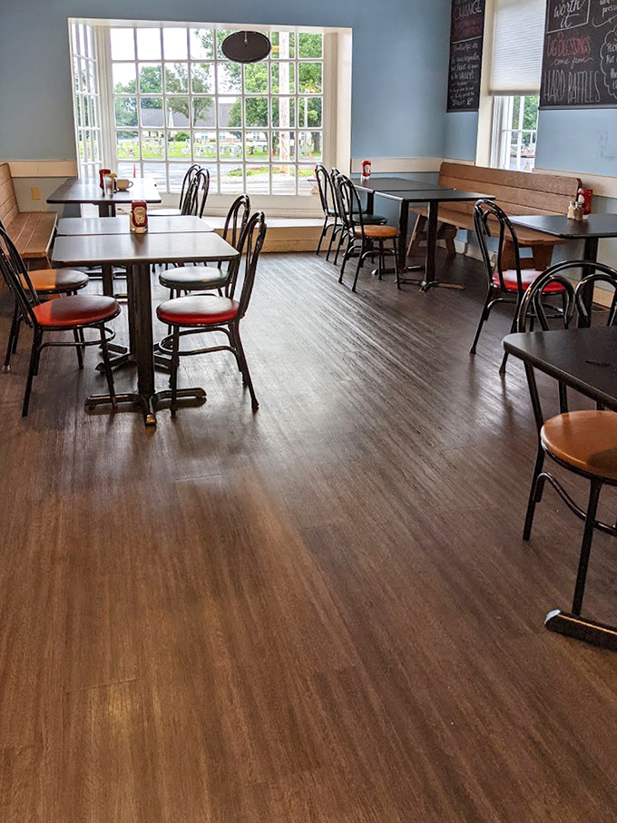 Sunlight streams through large windows, illuminating a dining room that feels like it's been waiting just for you all these years.