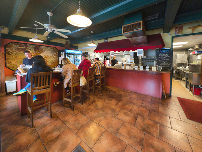 The counter seating offers front-row tickets to the culinary show. Sometimes the best entertainment in town involves olive oil and garlic.