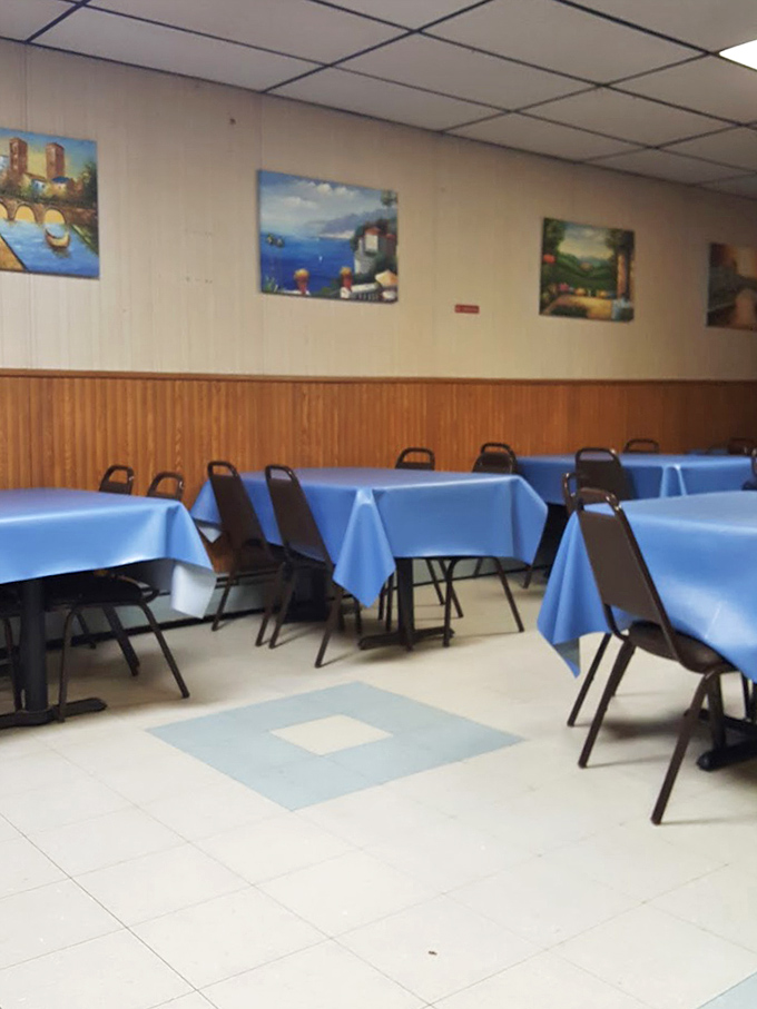 The dining room at Maroni's doesn't just serve meals; it serves memories&mdash;blue tablecloths and simple chairs setting the stage for countless family celebrations.