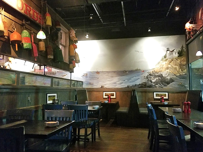 The dining room waits in quiet anticipation of the evening rush, blue chairs standing ready like sailors at attention before the dinner bell.
