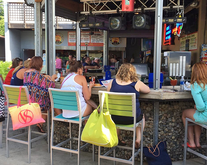 The outdoor bar: where island breezes meet island beverages. These colorful chairs have witnessed countless vacation stories unfold.