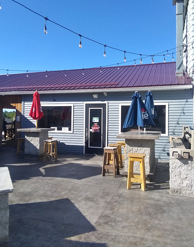 The outdoor space invites you to linger with simple wooden stools and colorful umbrellas. Al fresco dining, McKean-style.
