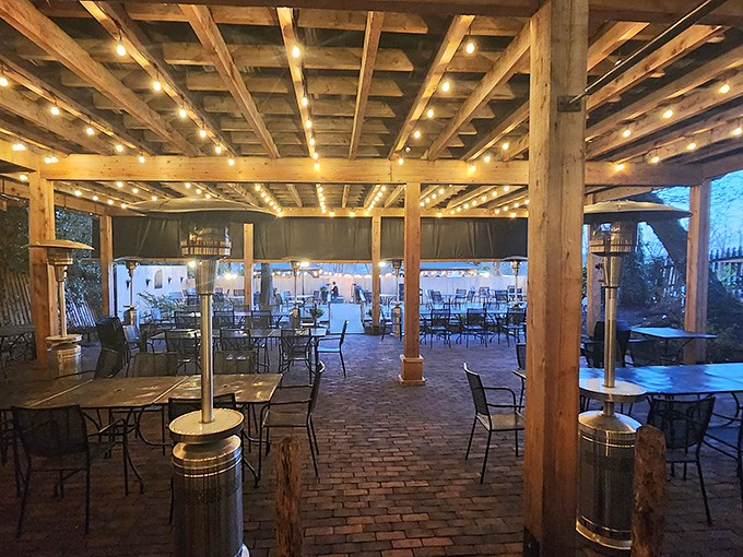 The covered patio brings outdoor dining to new heights with string lights that could make anywhere feel romantic.