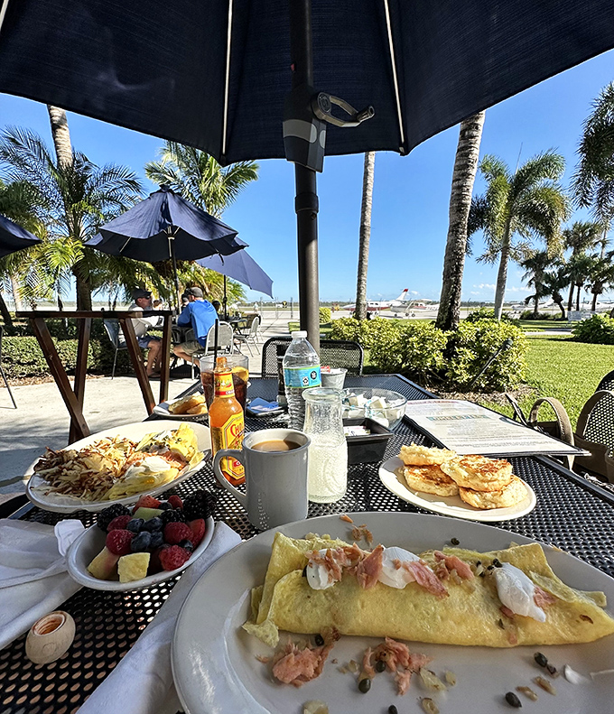 Breakfast al fresco! Nothing beats Florida sunshine, palm trees, and a plate of eggs while watching small aircraft come and go.