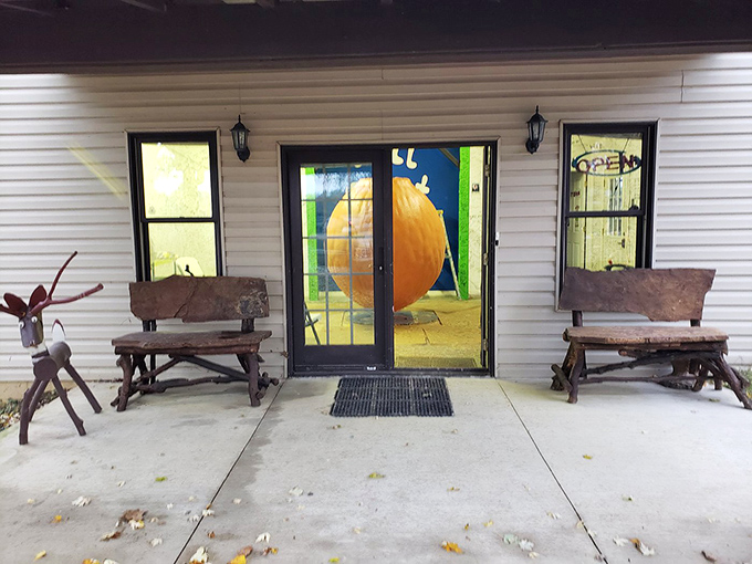 Rustic benches welcome weary travelers to the temple of paint. Through those doors lies chromatic enlightenment.