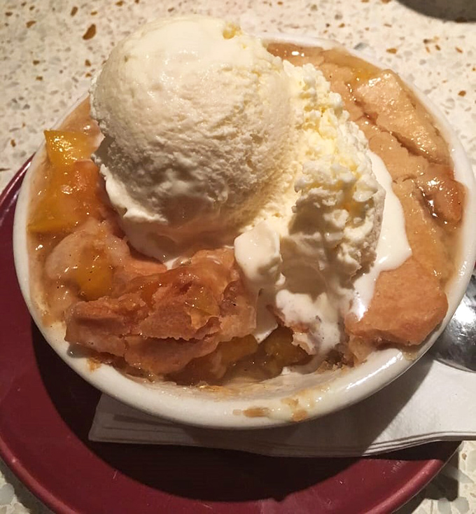 Peach cobbler &agrave; la mode that makes you wonder why you ever waste calories on trendy desserts when classics like this exist.
