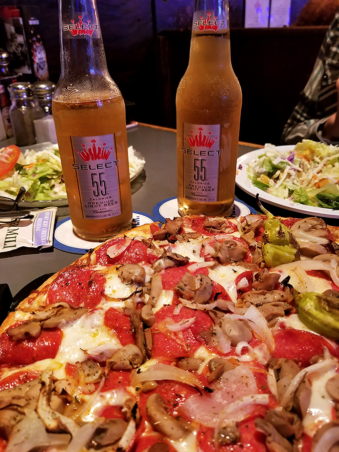 When beer meets pizza, beautiful things happen—especially when that pizza features a perfect ratio of mushrooms to cheese.