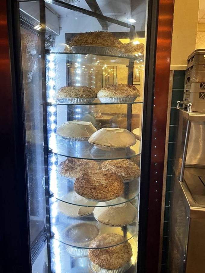 The pie case stands as a temple of temptation&mdash;each shelf offering circular solutions to life's problems, one slice at a time.