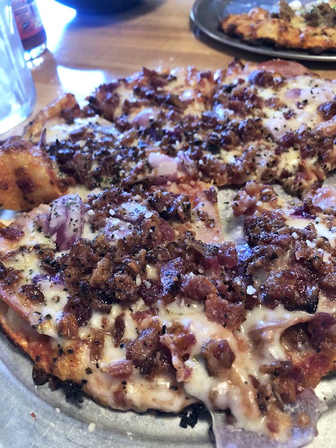 Meat lovers rejoice! This bacon-ham-onion symphony proves that sometimes more is more, especially when it comes to pizza toppings.