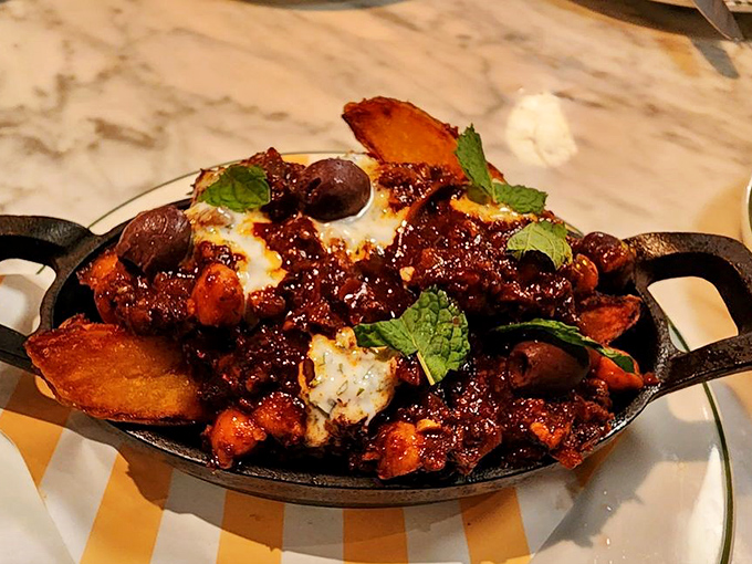 This isn't just comfort food&mdash;it's a warm hug on a cast-iron skillet. Melted cheese, savory sauce, and crispy potatoes creating the kind of dish memories are made of.