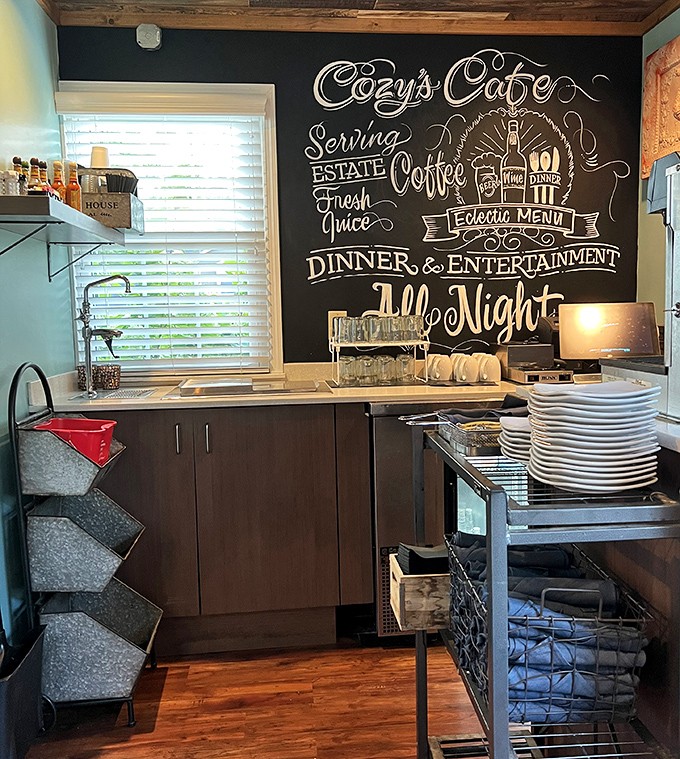 The chalkboard wall serves as both functional menu and artistic statement, showcasing the day's offerings with handcrafted charm.
