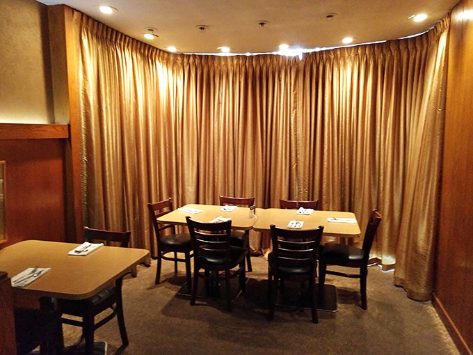 Private dining where deals are made and anniversaries celebrated. Those gold curtains have heard more secrets than a therapist's couch.