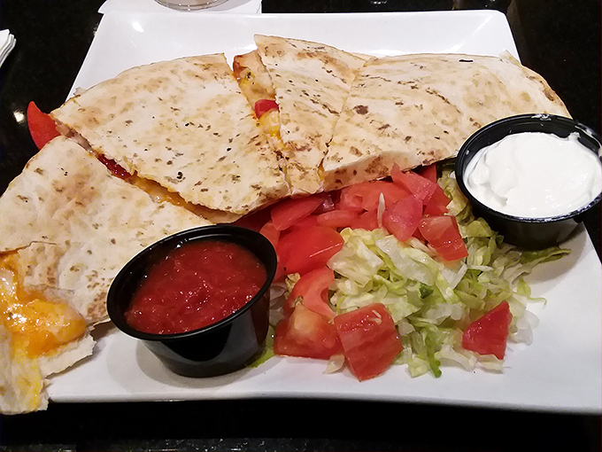 This quesadilla isn't messing around. Crispy, cheesy, and served with enough fresh vegetables to convince yourself it's practically a salad.
