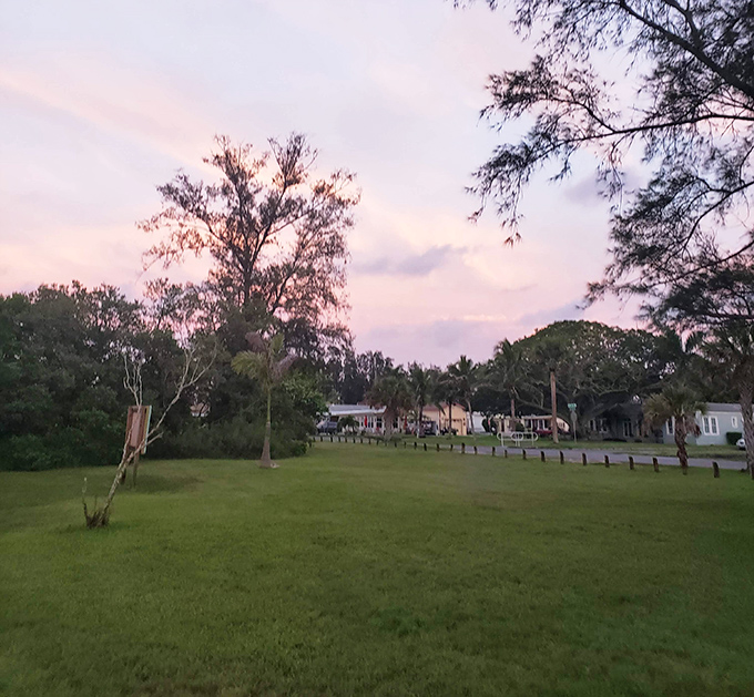 Sunset paints the sky over Cortez's green spaces, where residents gather to debate life's important questions, like "grouper or snapper tonight?"