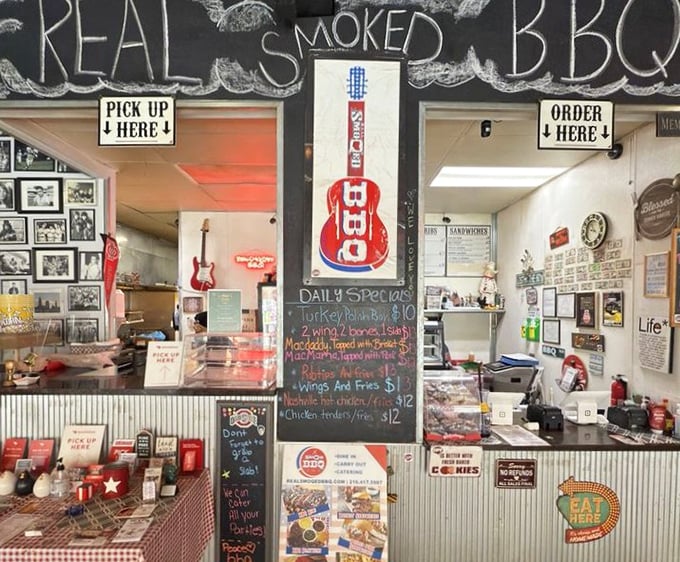 Where the magic happens: "Pick up here" and "Order here" signs frame a counter that's the gateway to smoked meat nirvana.