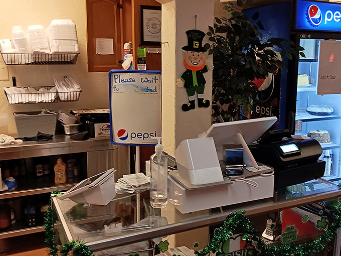 The register area&mdash;where you'll reluctantly conclude your Farm House adventure. That leprechaun decoration suggests they're hiding a pot of culinary gold in the kitchen.