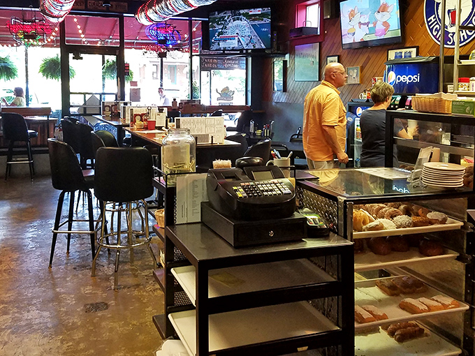 Where the magic happens – fresh donuts temptingly displayed like the breakfast jewelry they truly are.