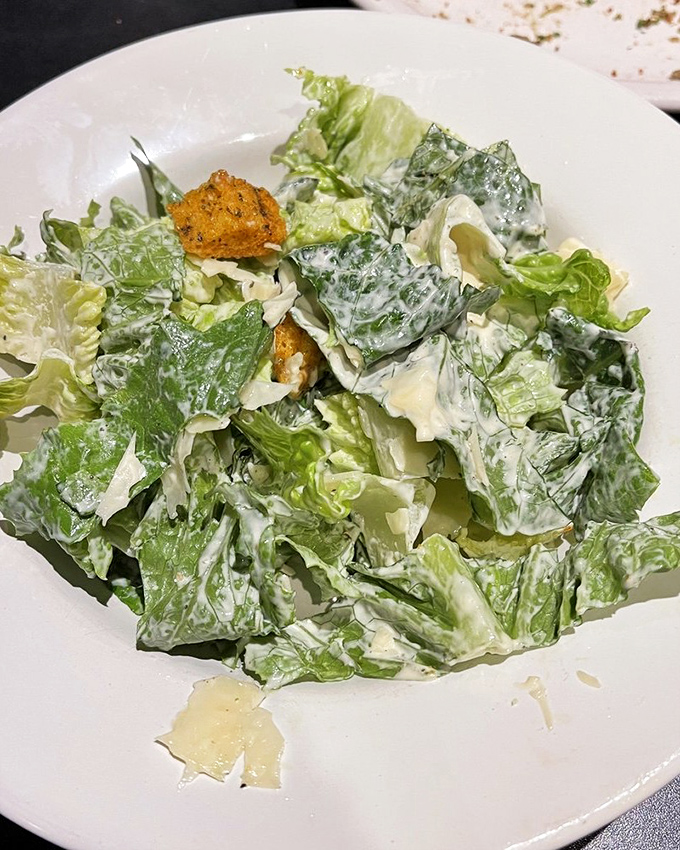 A Caesar salad that actually deserves attention&mdash;crisp romaine dressed just right, proving The Tilted Skillet knows its way around vegetables too.