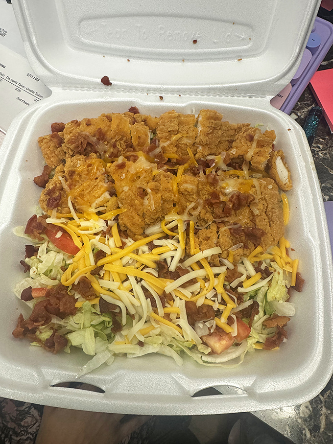 This isn't just a salad; it's a protein party where chicken and bacon invited cheese, and vegetables showed up anyway.