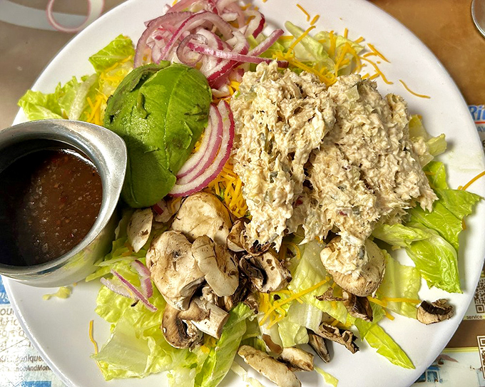 Even the salads at Sax's come with a side of generosity&mdash;fresh ingredients piled high enough to make you momentarily forget about those cinnamon rolls.
