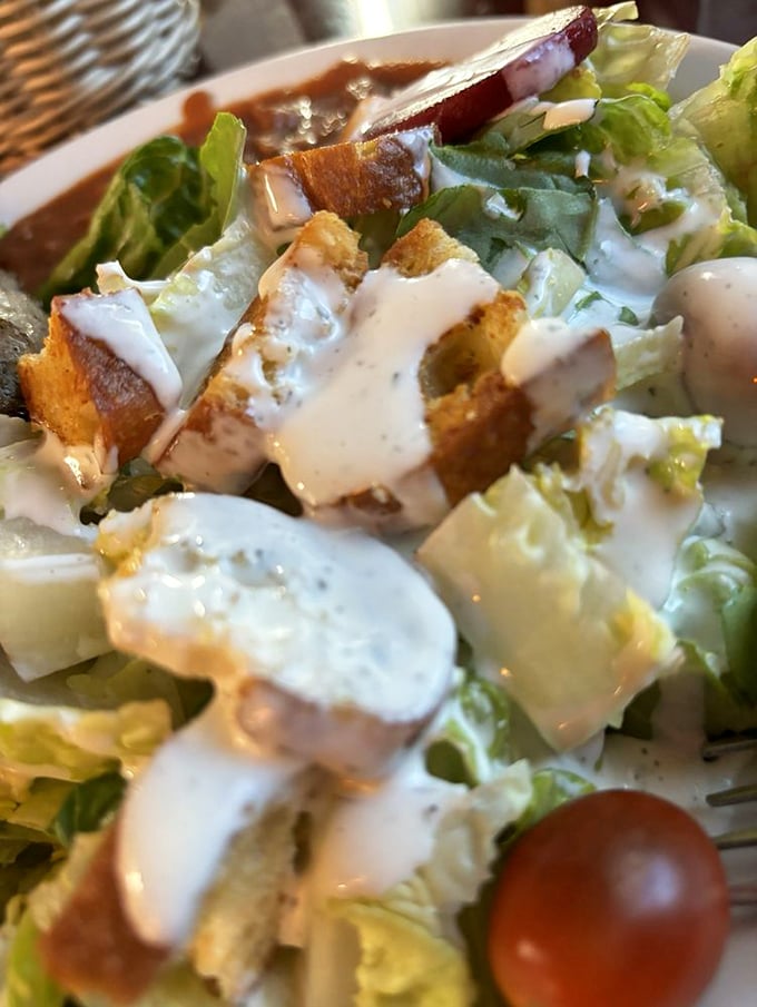 Even the salad gets the respect it deserves&mdash;crisp greens, house-made dressing, and croutons that crunch like they mean business.