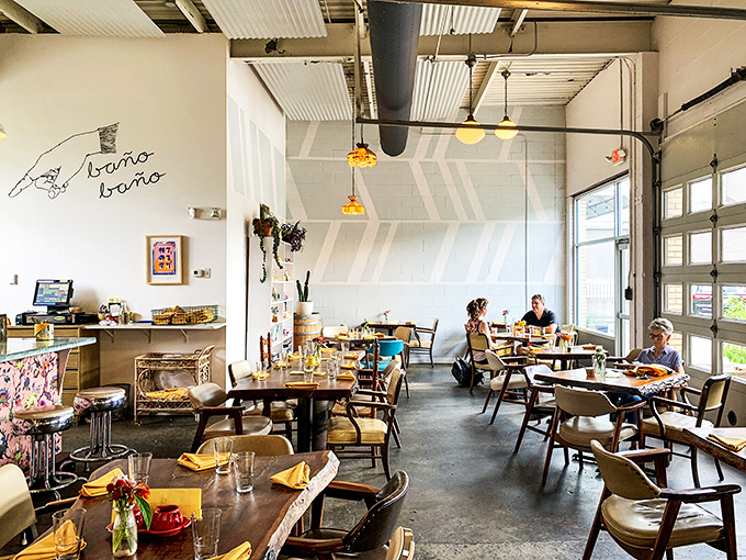 Mid-century chairs and wooden tables create a dining room that feels like the coolest friend's house—if that friend happened to be a culinary genius.