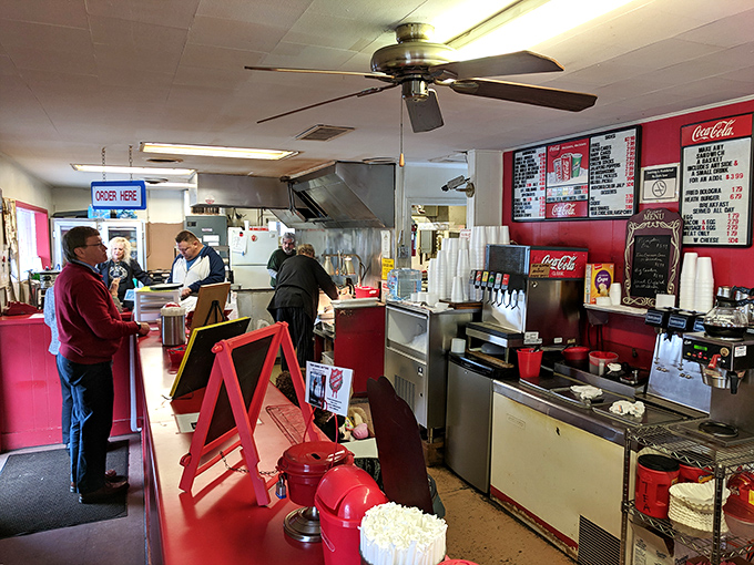 The counter where burger dreams come true, staffed by folks who know most customers by name and order.