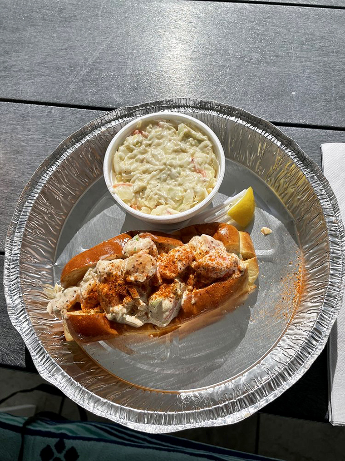 A seafood roll that belongs in the Sandwich Hall of Fame &ndash; overflowing with fresh seafood and served with a side of coastal bliss.