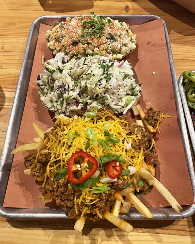Not just afterthoughts, these sides deserve their moment. Mac and cheese, slaw, and chili fries that could stand alone as main attractions.