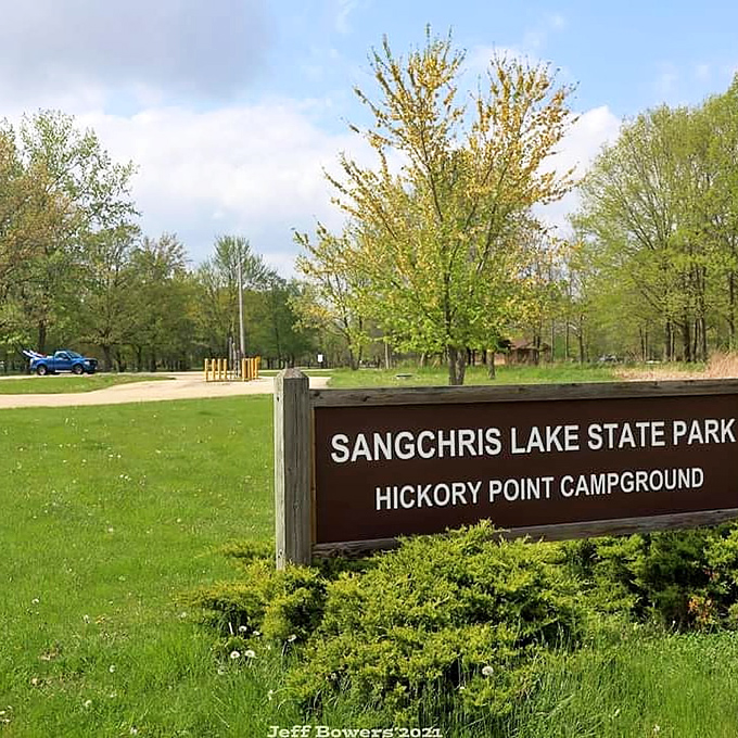 Hickory Point Campground welcomes visitors with its wooden sign &ndash; the official starting line for your outdoor adventures.