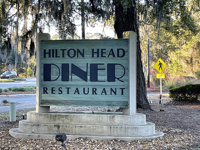 The sign that's guided countless hungry travelers to breakfast nirvana, standing sentinel among Spanish moss-draped trees like a beacon of hope.