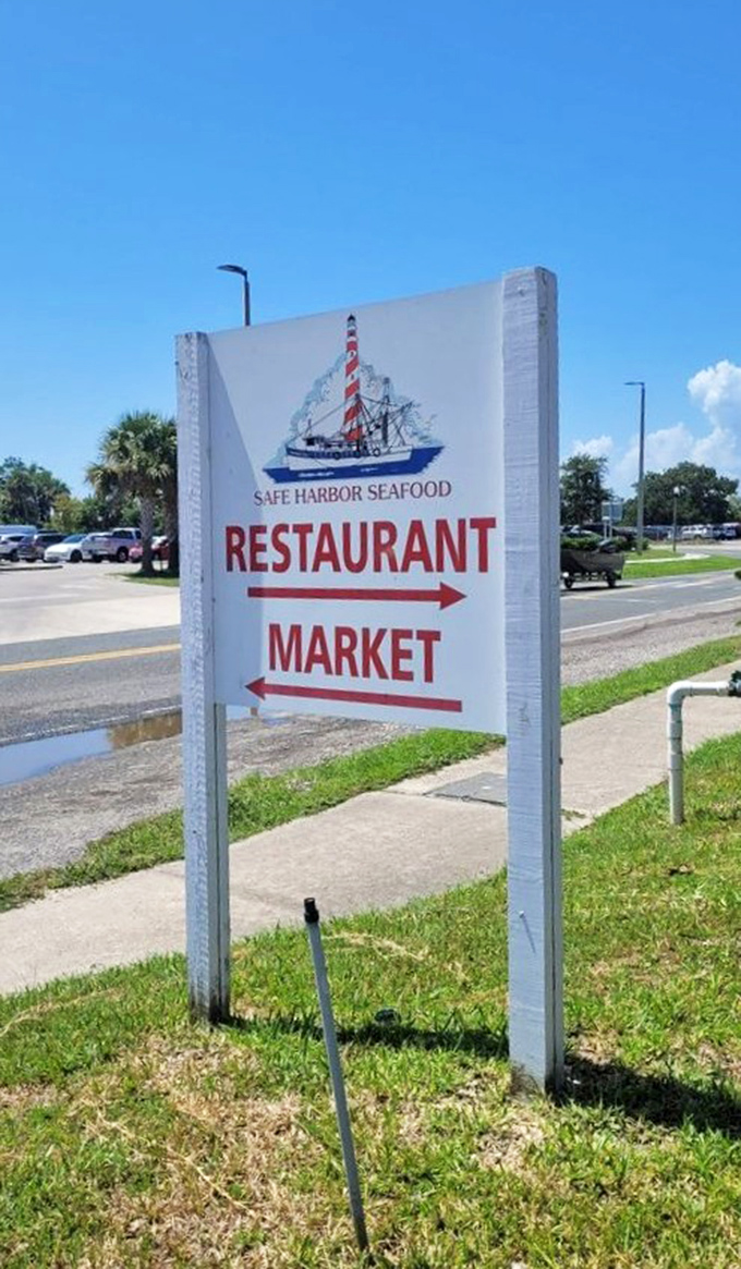 The sign points the way to seafood nirvana. Follow the arrows to happiness&mdash;restaurant this way, market that way, bliss in either direction.