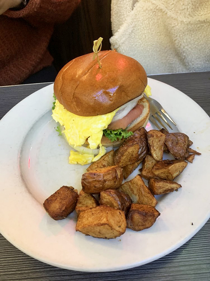 A breakfast sandwich that's dressed for success, with home fries that look like they've been tanning to golden perfection.