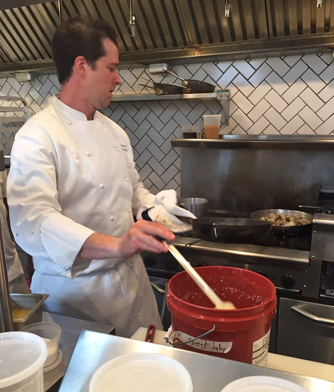 In the kitchen, precision meets passion &ndash; the chef's whites a canvas for the morning's culinary performance.