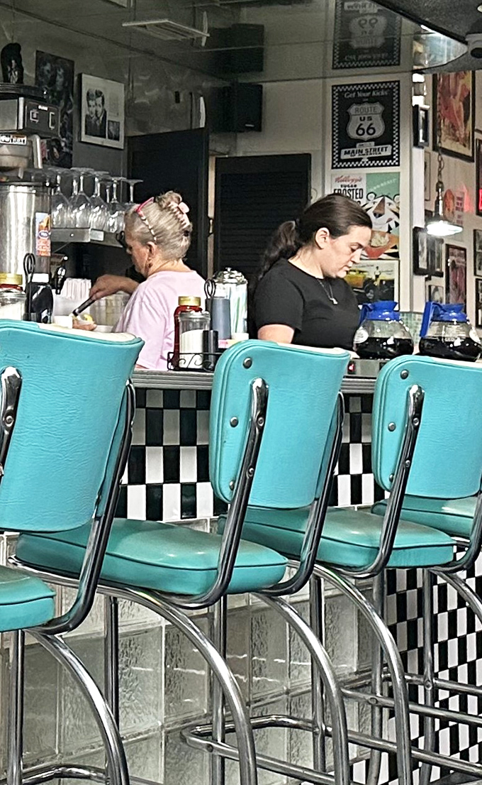 The counter crew orchestrates breakfast magic with practiced precision, turning ordinary mornings into memorable culinary experiences for lucky diners.