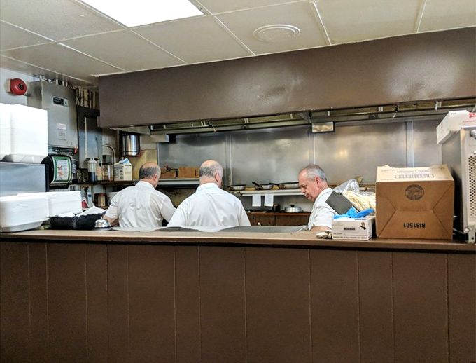 The kitchen maestros in their element &ndash; three breakfast conductors orchestrating the morning symphony of sizzles and flips.