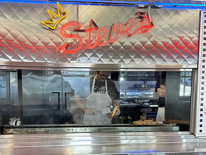 Behind the glass, sandwich artisans perform their craft with the precision of surgeons and the soul of poets.