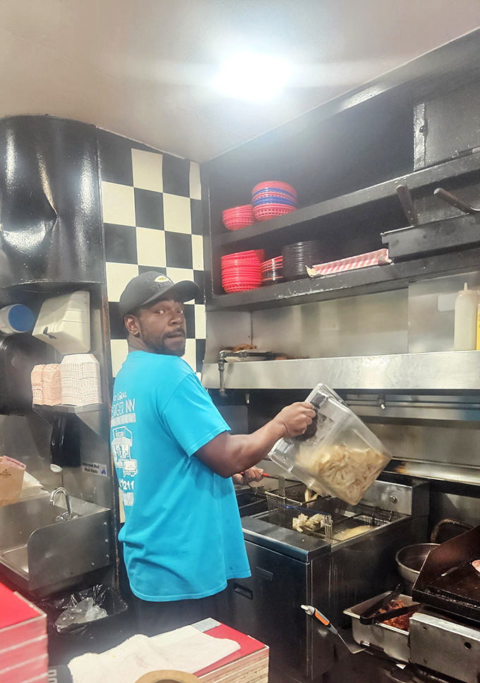 Where the magic happens. Those hands have likely flipped more burgers than most of us have flipped TV channels.