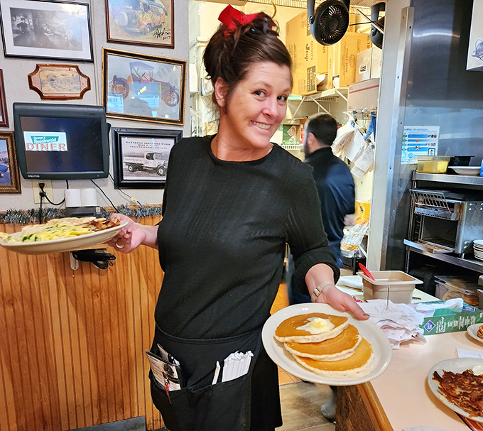Carrying plates like Olympic torches, the servers here deliver breakfast gold with the efficiency of someone who knows exactly what you need.