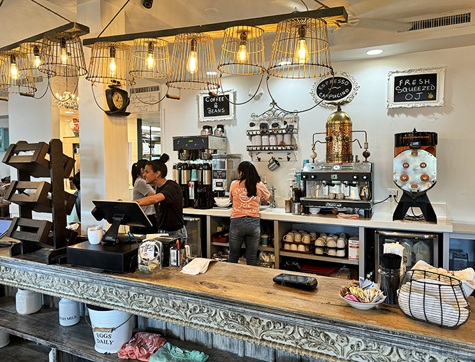 The coffee command center where morning miracles are orchestrated. Those baristas are basically caffeine alchemists turning beans into liquid gold.
