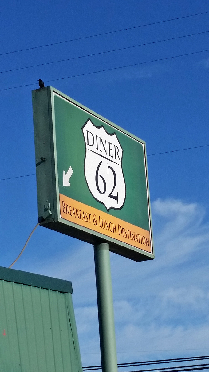 The highway-inspired sign stands tall against Oregon's blue sky, guiding hungry pilgrims to their breakfast salvation.