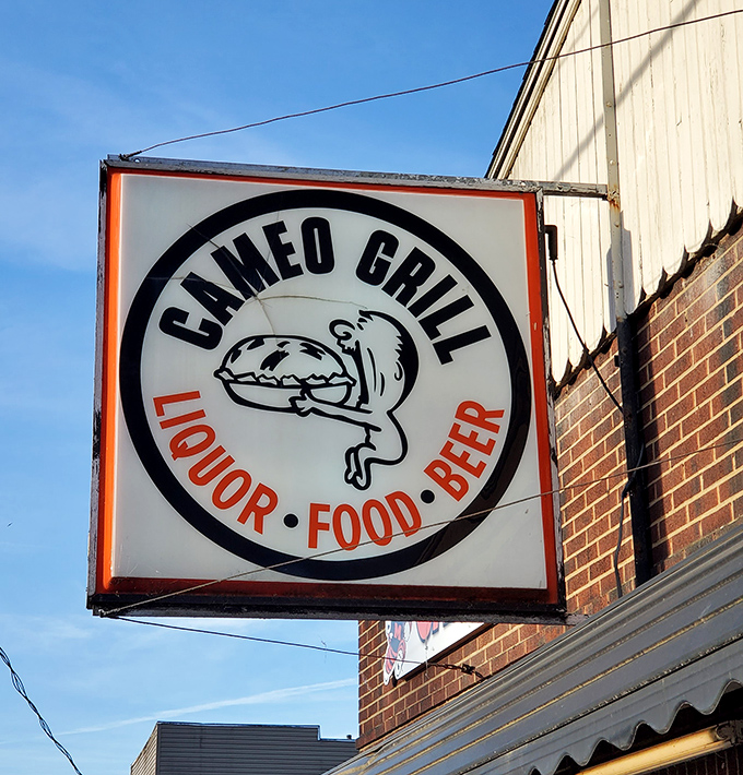 The sign's cartoon character looks as happy as you'll feel after demolishing their signature burger. Truth in advertising.